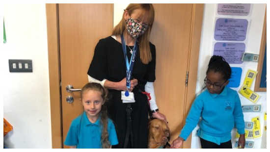 Jewell Academy pupils enjoy tender loving care from therapy dog Elvis ...